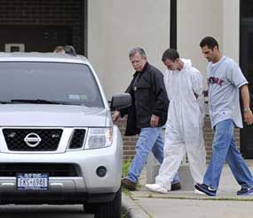 Suspect arrested in quadruple-murder pharmacy shooting