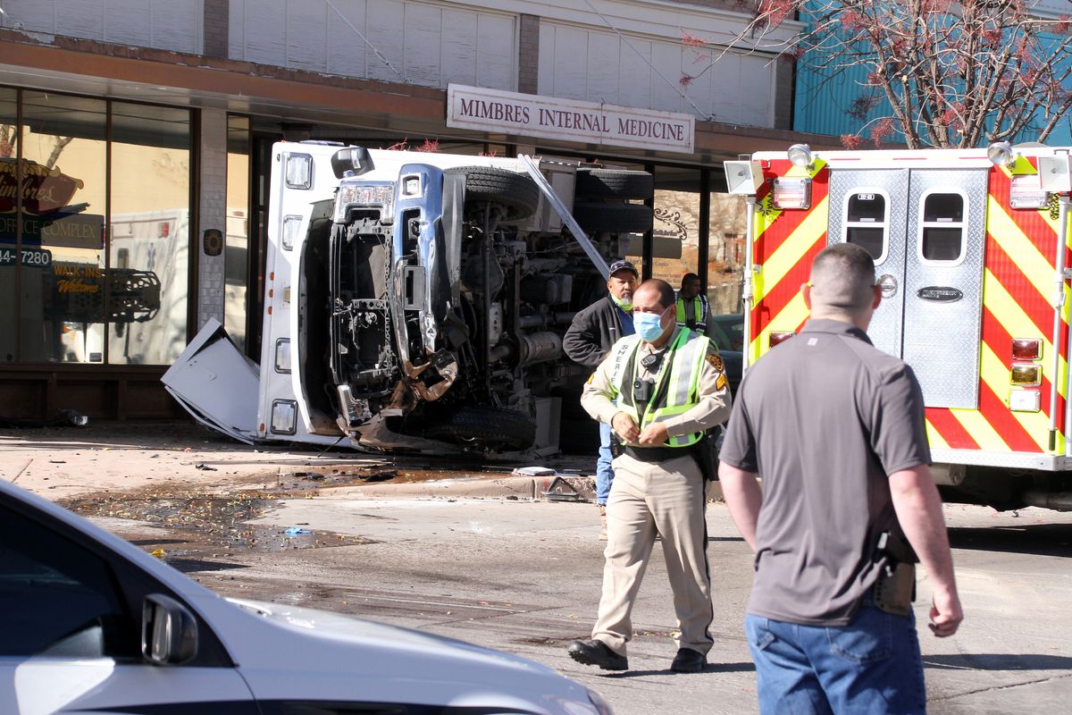 NM ambulance, police unit collide at intersection