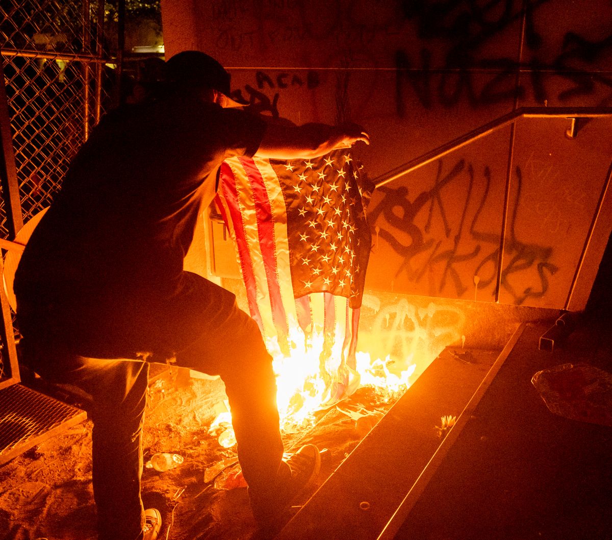 Federal officers gas Portland protesters who set fire at courthouse