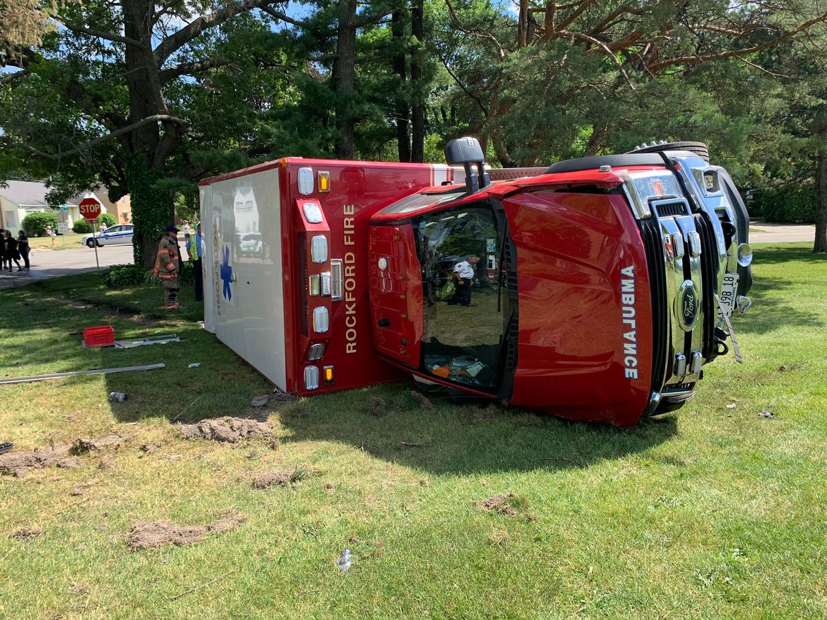 2 EMS workers hurt when Ill. rig struck by vehicle, flips