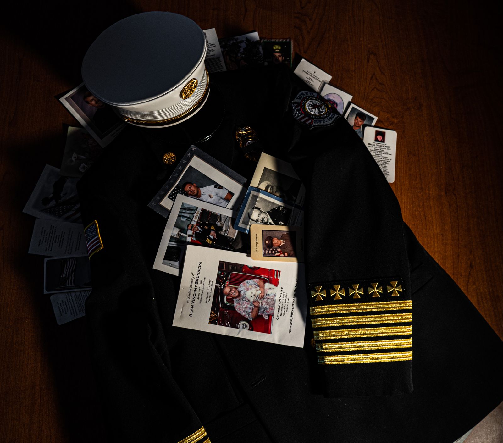 Honoring fallen firefighters by carrying funeral cards in Class A uniform
