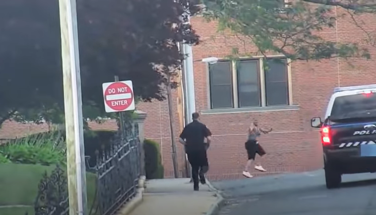 'Chilling' video: Man runs around pointing gun at officers, bystanders