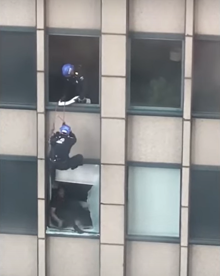 Watch: NYPD rescues fugitive threatening to jump from 31st floor of ...