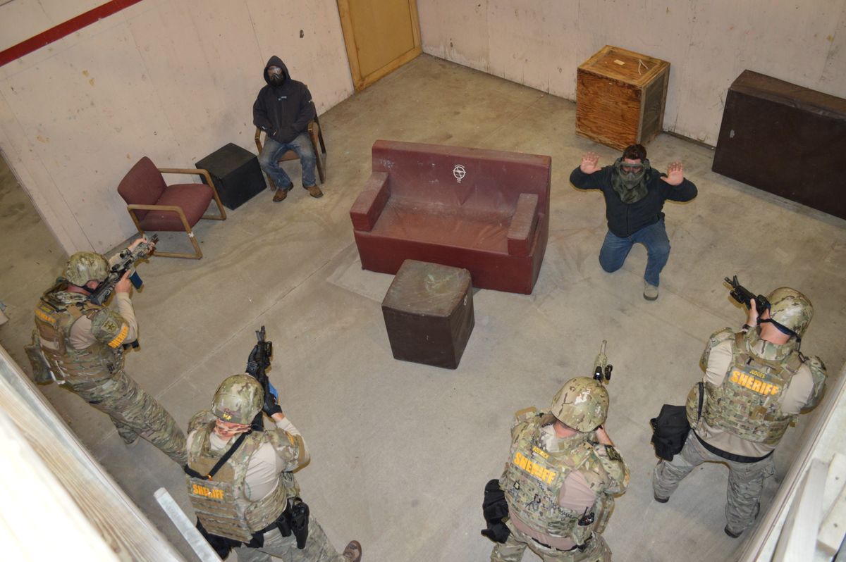 SWAT team training for drug raid tactical entry